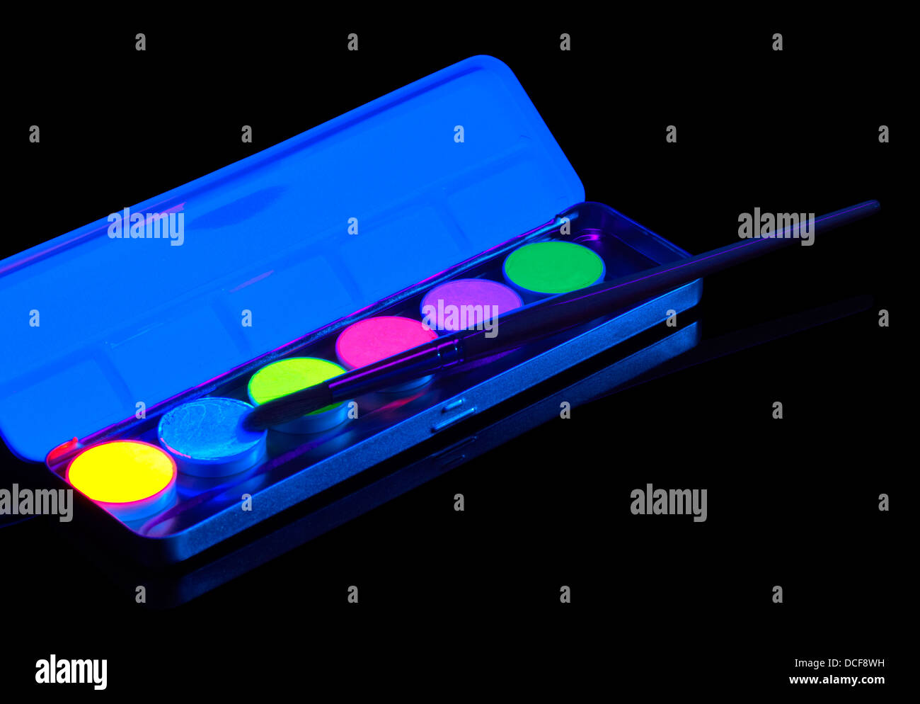 box with fluorescent watercolors in black reflective back, ultraviolet ...