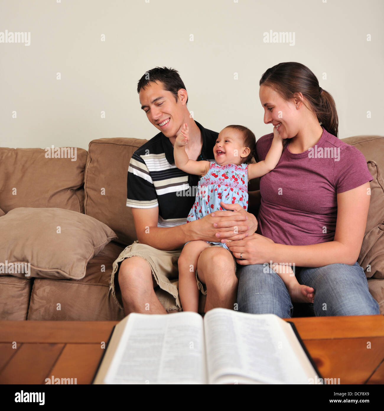 A Young Christian Family Together Stock Photo - Alamy