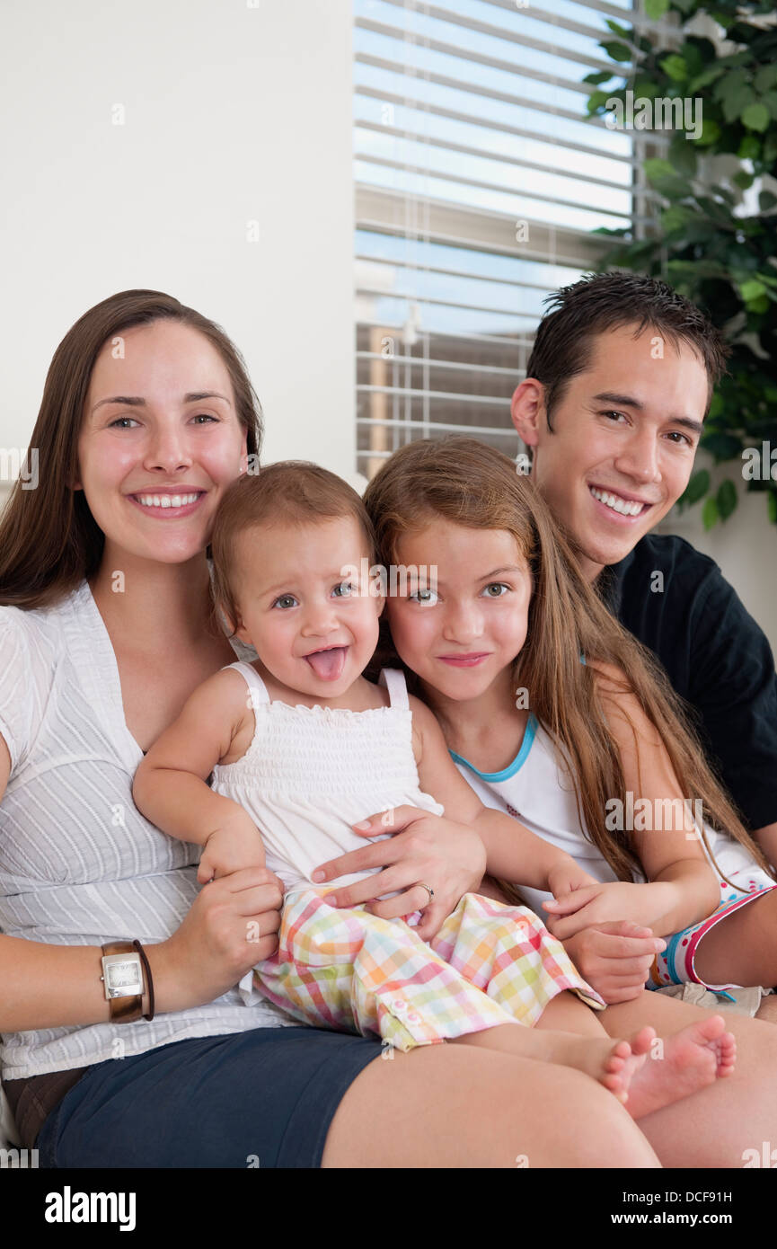 Portrait Of A Young Family Stock Photo - Alamy