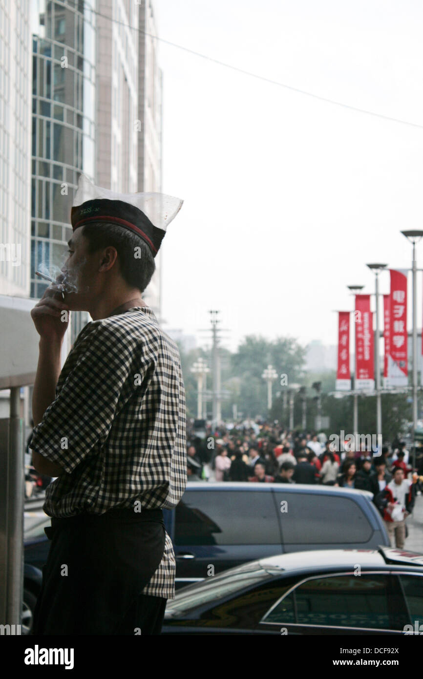 China smoking cigarette hi-res stock photography and images - Alamy