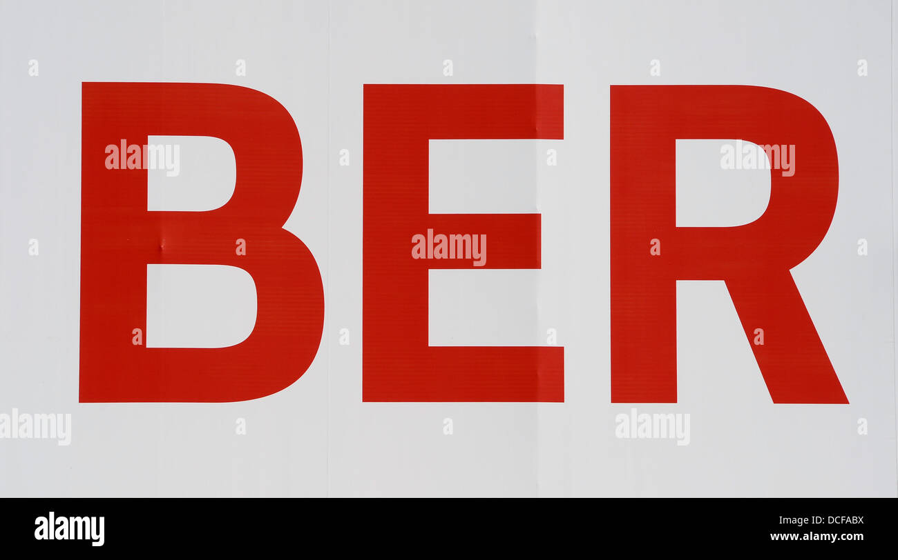 The logo of the Berlin-Brandenburg Airport BER is pictured in front of ...