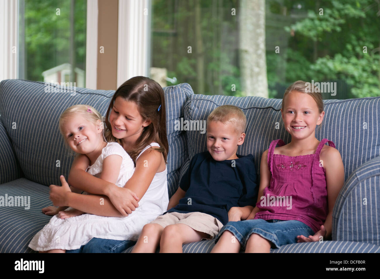 Children Sitting Together Stock Photo - Alamy