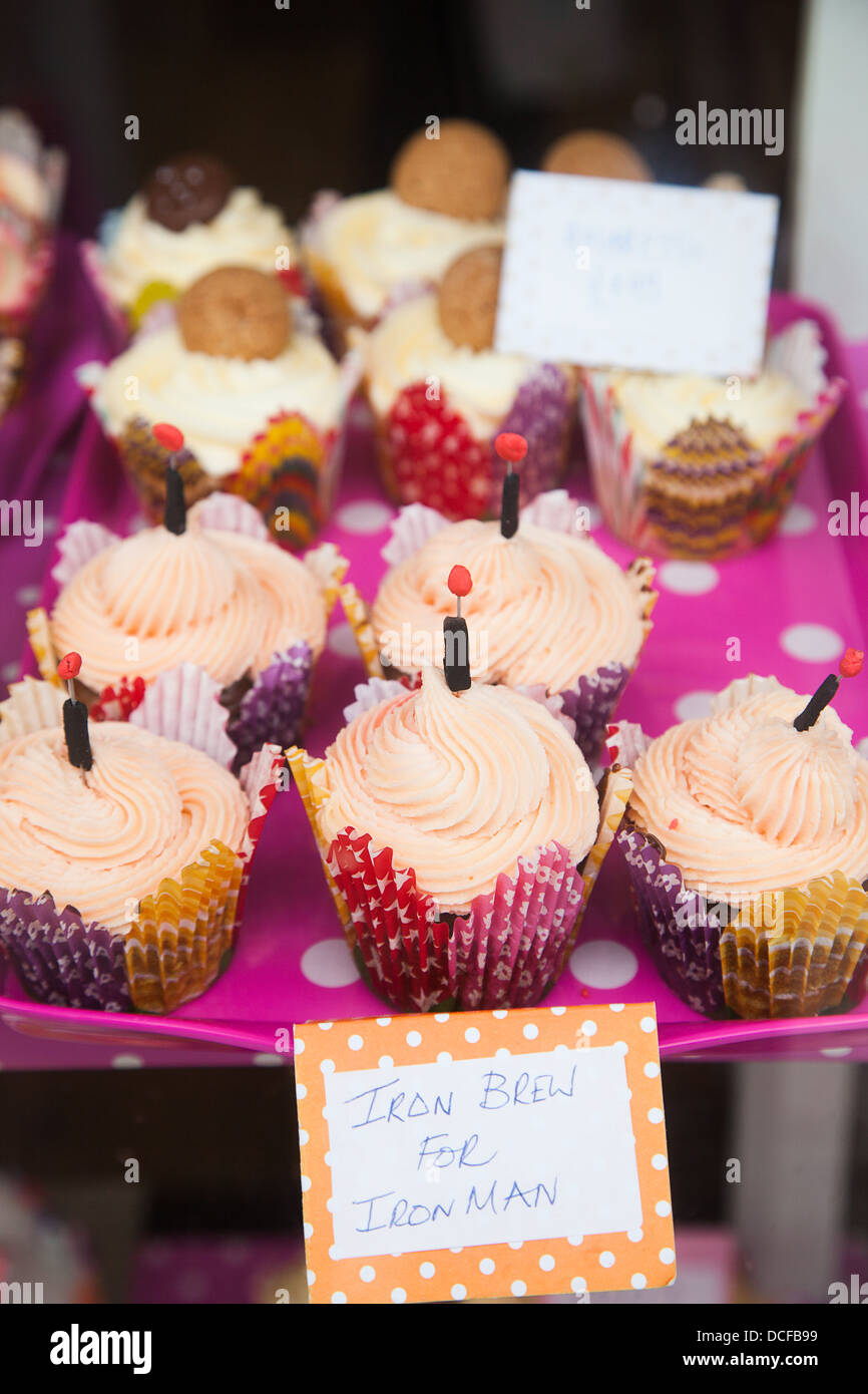 A window display of decorative cakes with icing and caption Stock Photo ...