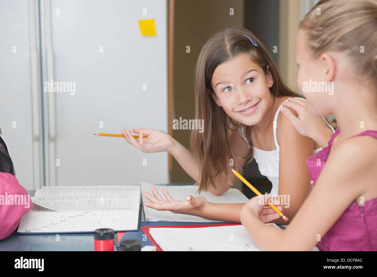 Children Doing Homework At Home Stock Photo - Alamy