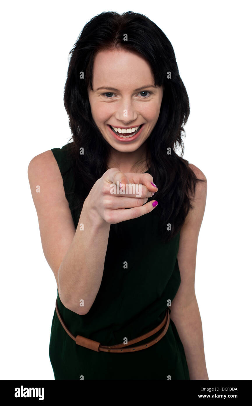 Gorgeous young girl in black attire pointing you out Stock Photo - Alamy