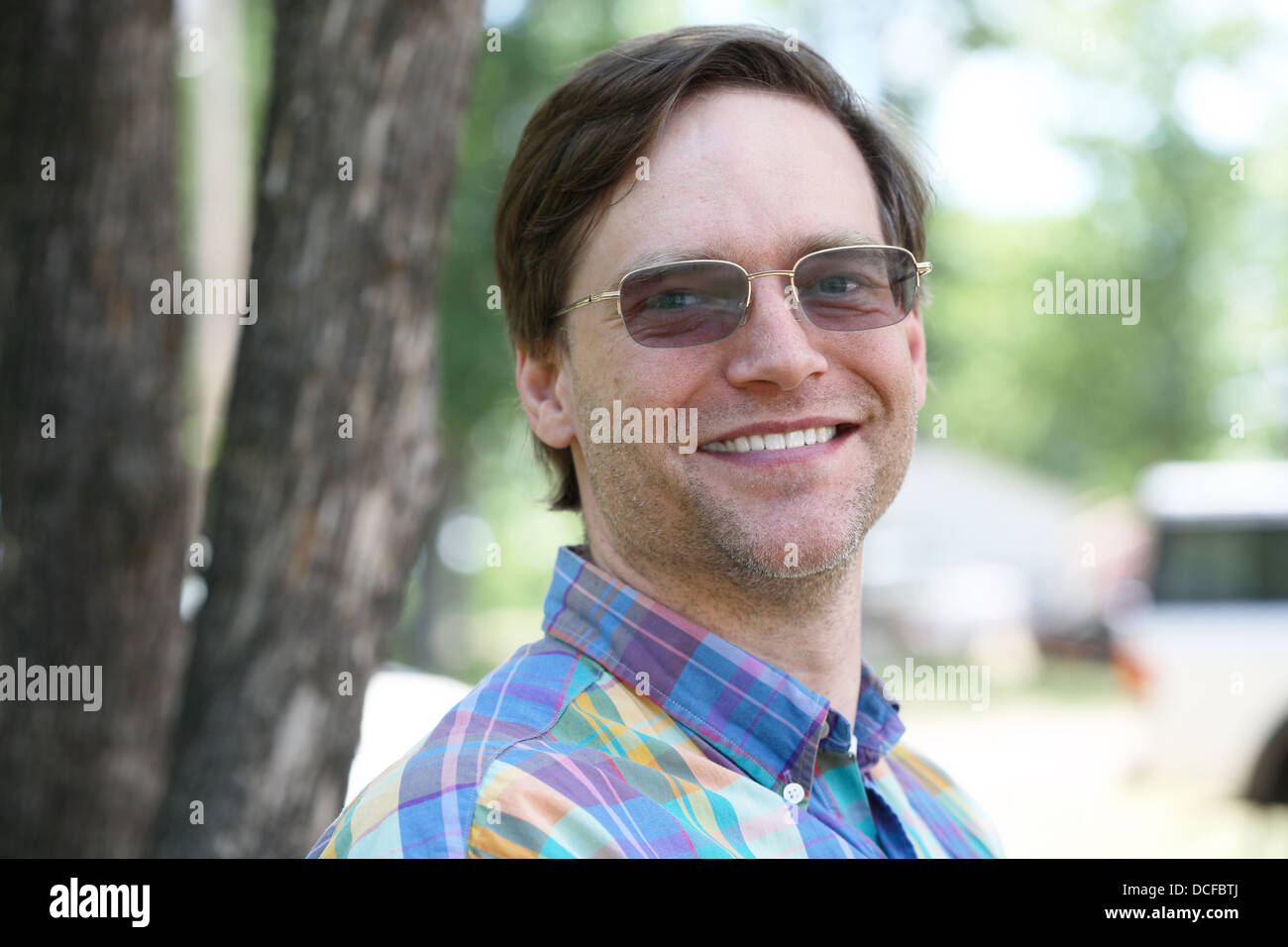 Smiling man enjoying outdoors in summer Stock Photo - Alamy