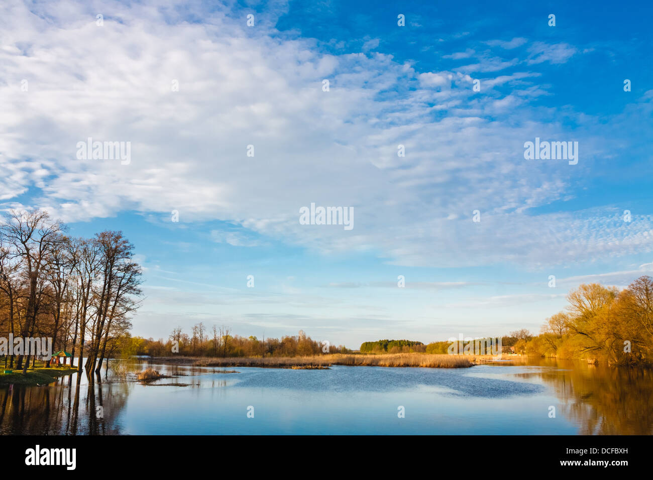 Sky And Clouds Reflection On River Stock Photo - Alamy
