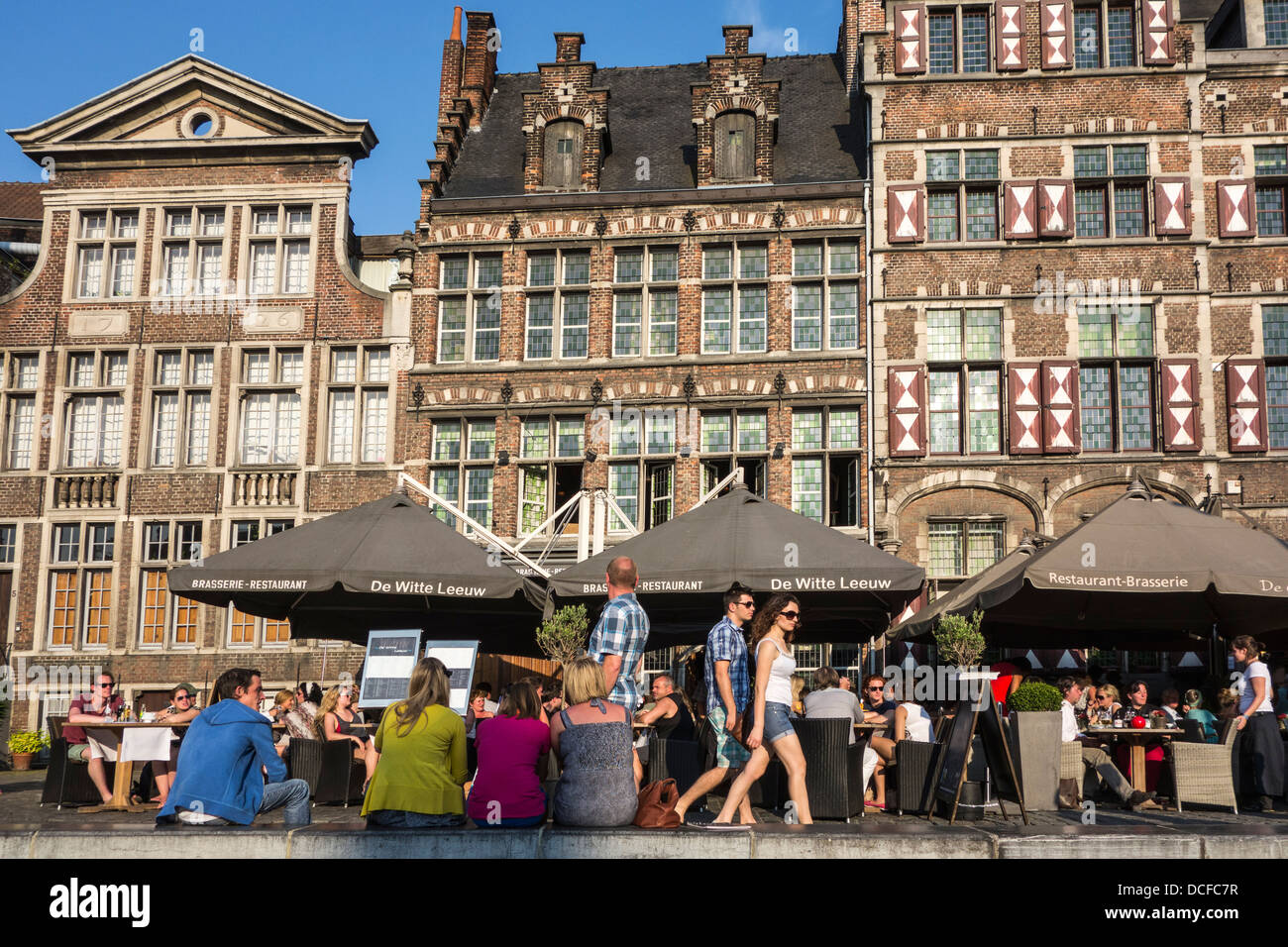 Tourists at pavement café on the Graslei / Grass Lane in summer in ...