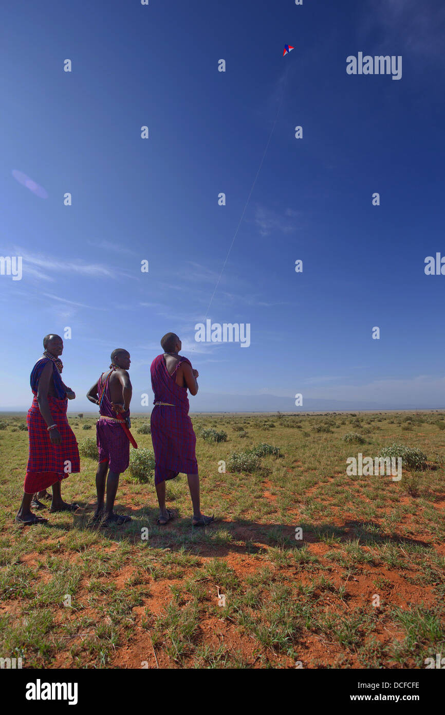 Masai Warriors flying a kite for the first time. Amboselli area. Kenya ...
