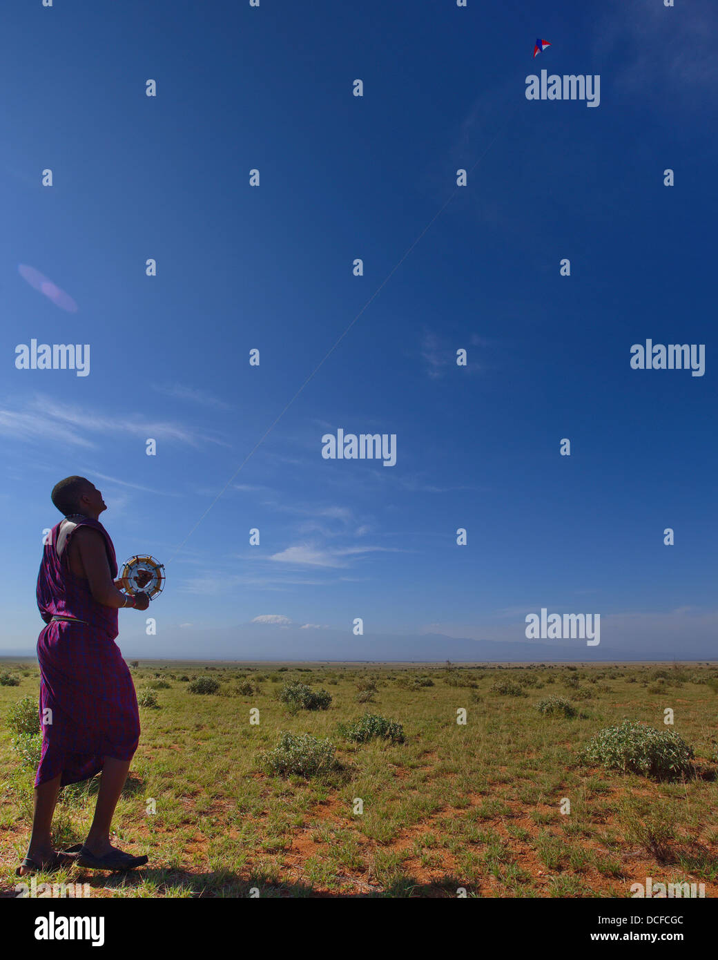 Masai Warriors flying a kite for the first time. Amboselli area. Kenya ...
