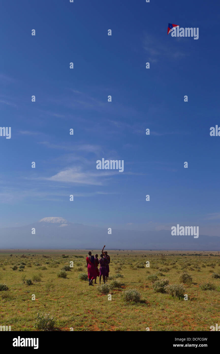Masai Warriors flying a kite for the first time. Amboselli area. Kenya ...