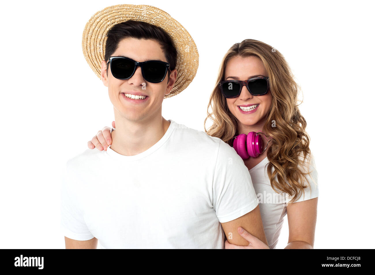 Dashing young couple wearing shades and hat isolated white Stock Photo ...