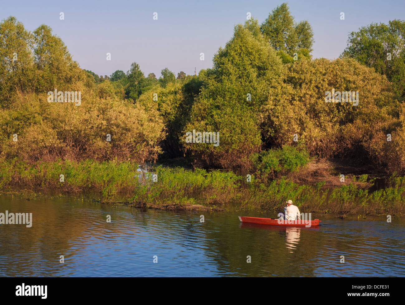 Old man rowing boat hi-res stock photography and images - Alamy