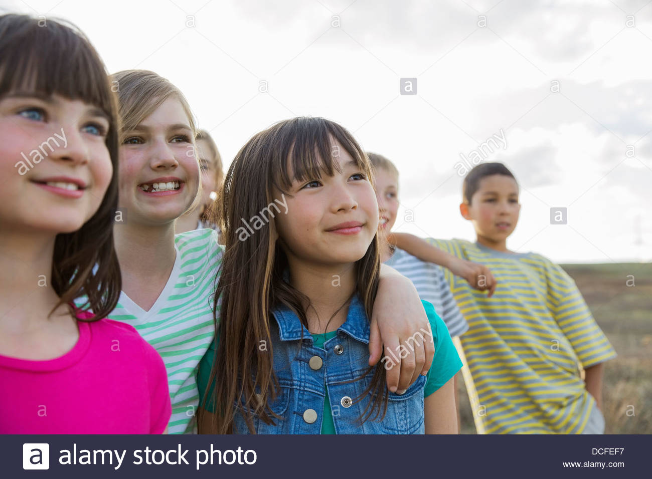 Kids standing smiling hi-res stock photography and images - Alamy