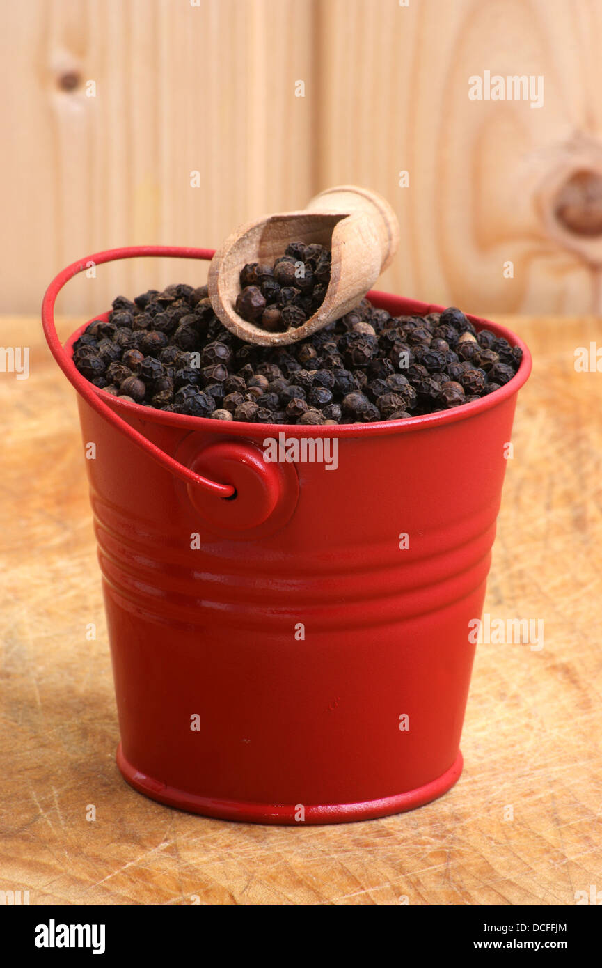 some hot pepper corn in a red bucket Stock Photo - Alamy