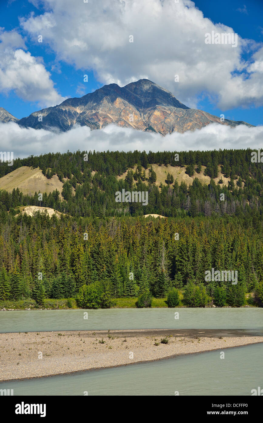 Pyramid mountain towering over the bench and the Athabasca river in ...