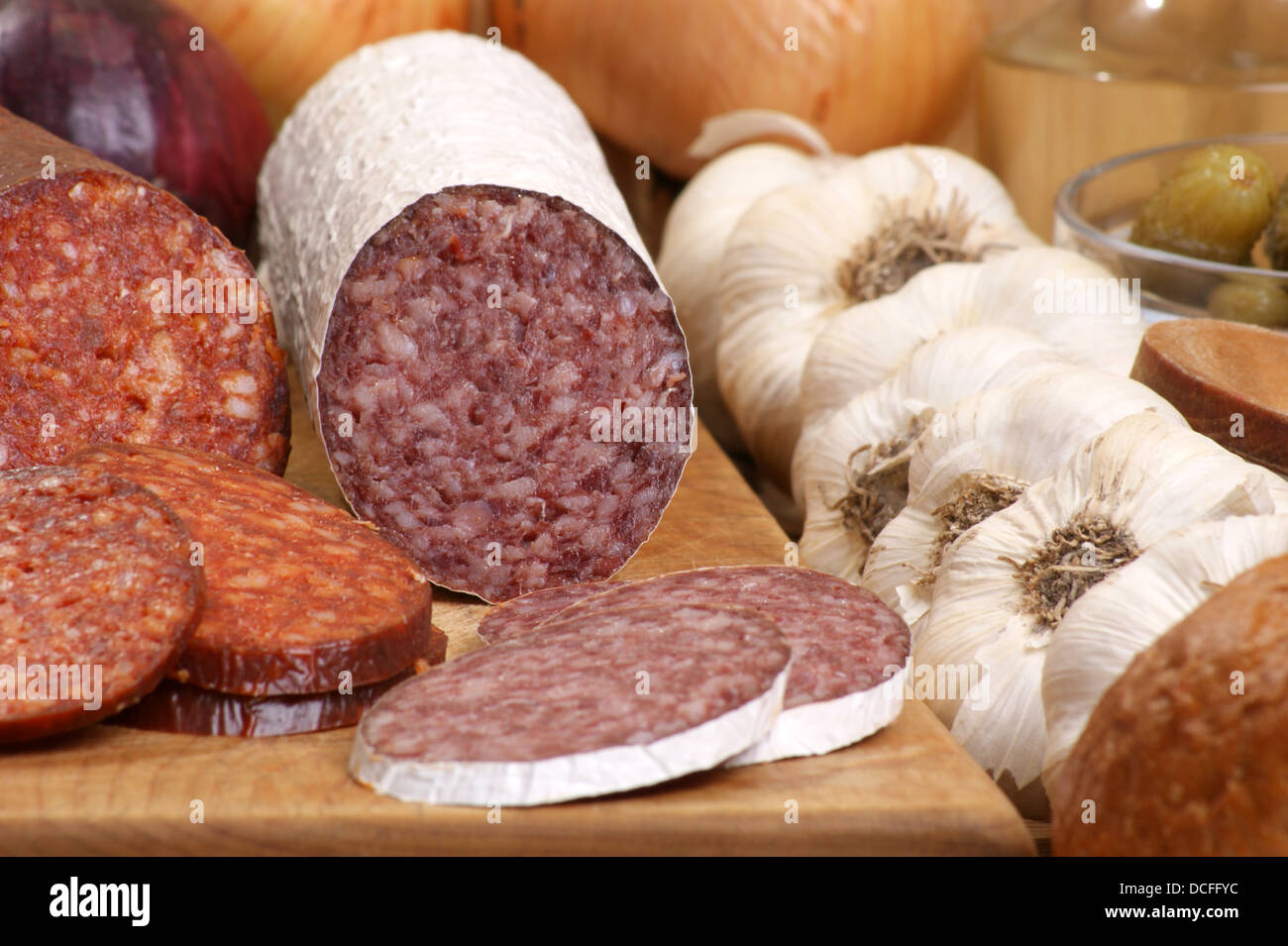 salami and some slices salami on a timber board Stock Photo - Alamy