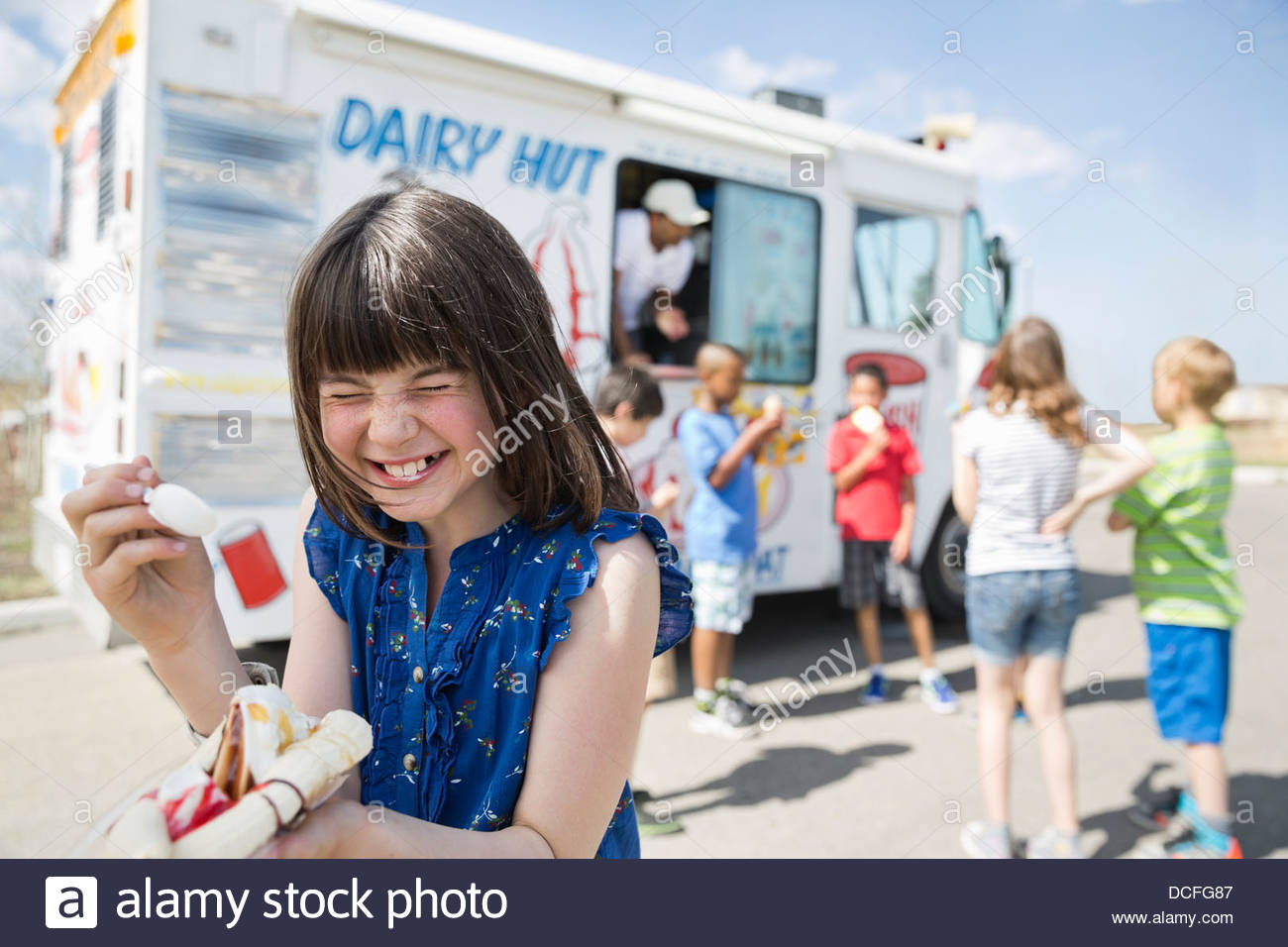 Girl laughing while eating banana split hi-res stock photography and ...