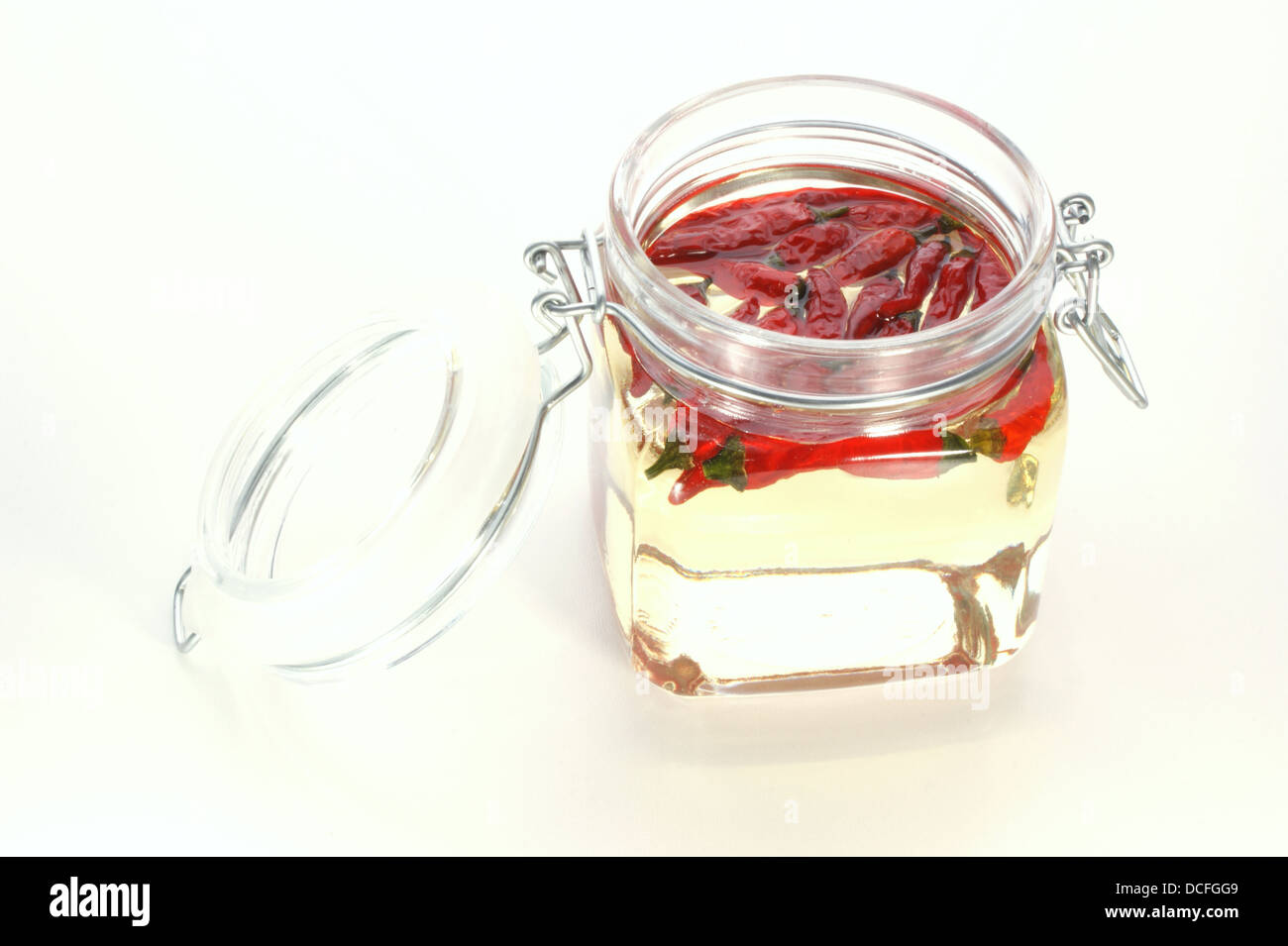 organic red chili in a jar with oil Stock Photo - Alamy