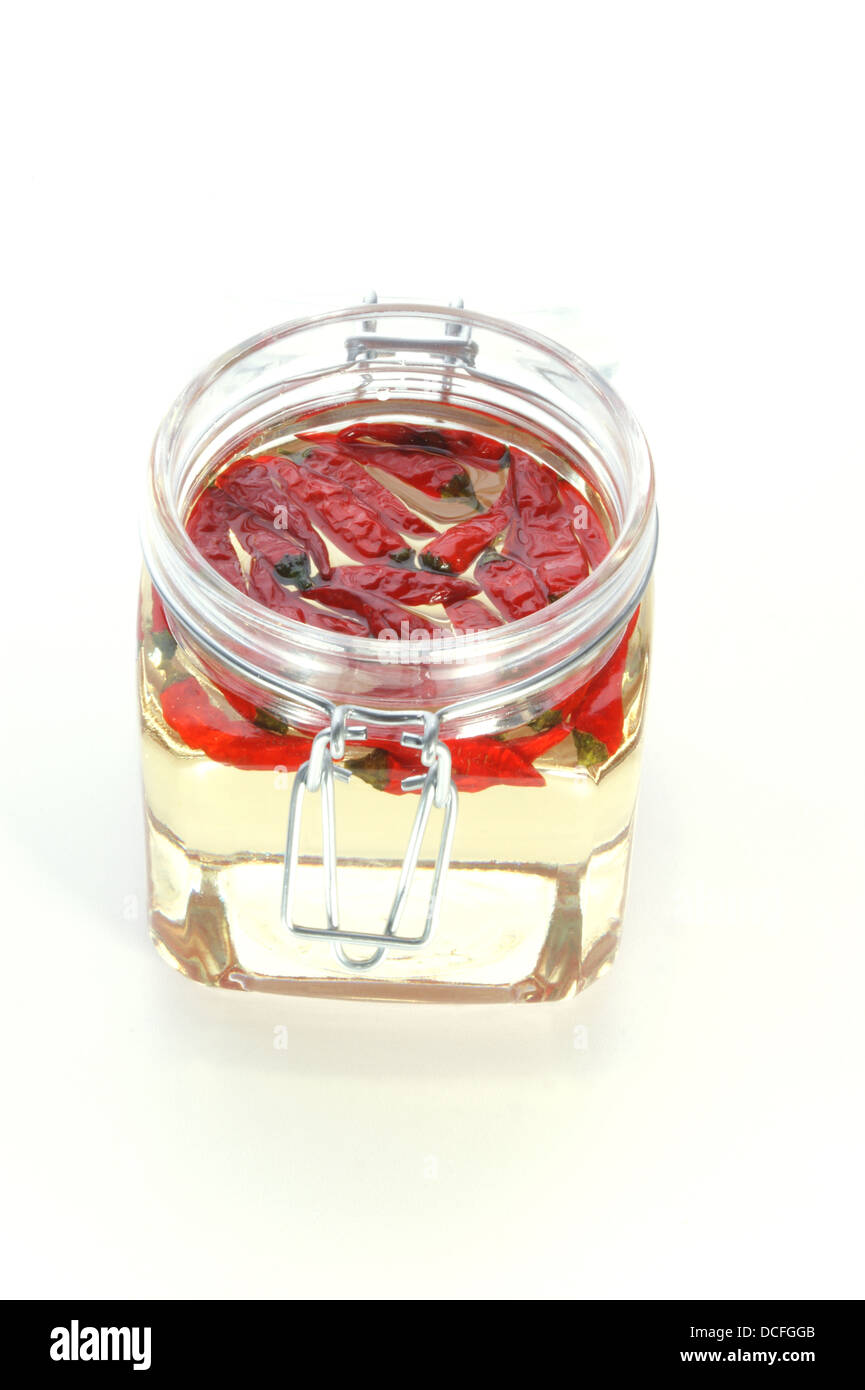 organic red chili in a jar with oil Stock Photo - Alamy