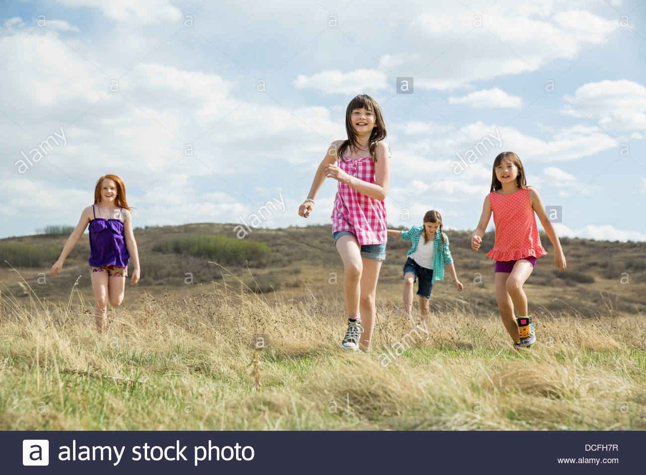 Children running through field hi-res stock photography and images - Alamy