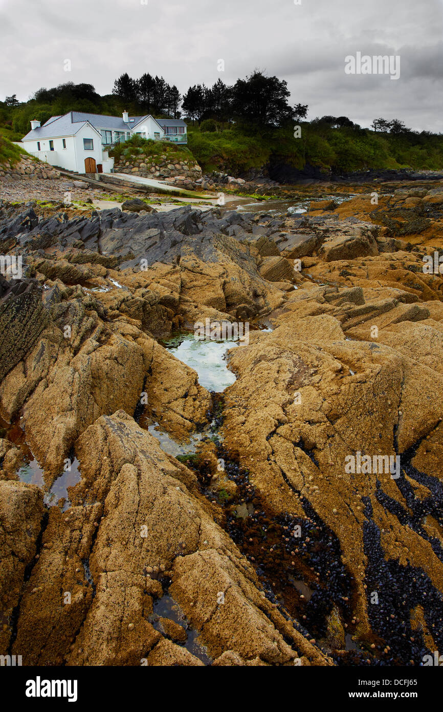 Rockpools and boathouse at Kells Bay, County Kerry, Ireland Stock Photo ...