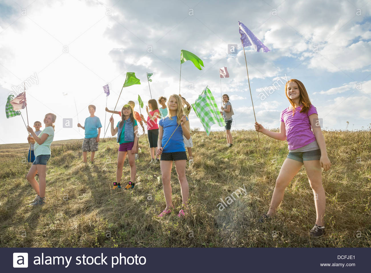 Group kids holding flags up hi-res stock photography and images - Alamy