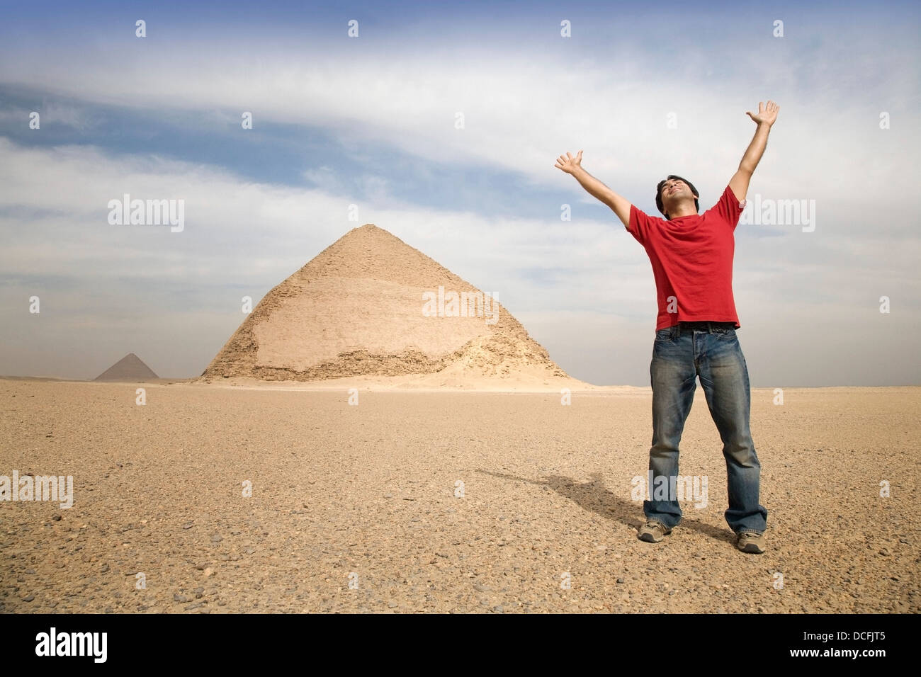 Man Standing Near The Pyramids With His Arms Up; Cairo,Egypt,Africa ...