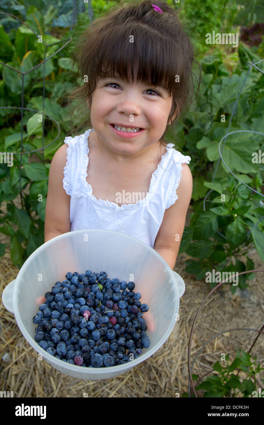 Girl with hands full of berries hi-res stock photography and images - Alamy