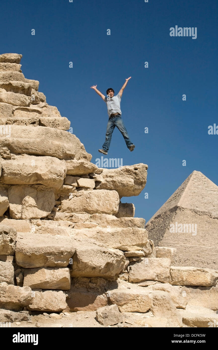 Man Jumping On Part Of A Pyramid In The Desert Stock Photo - Alamy