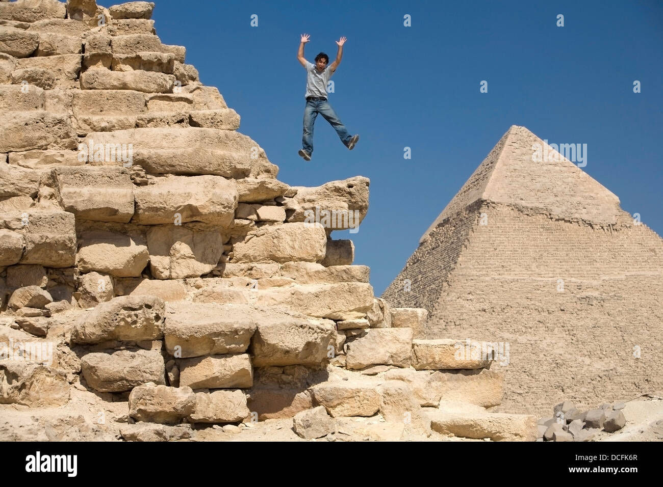 Man Jumping On Part Of A Pyramid In The Desert Stock Photo - Alamy