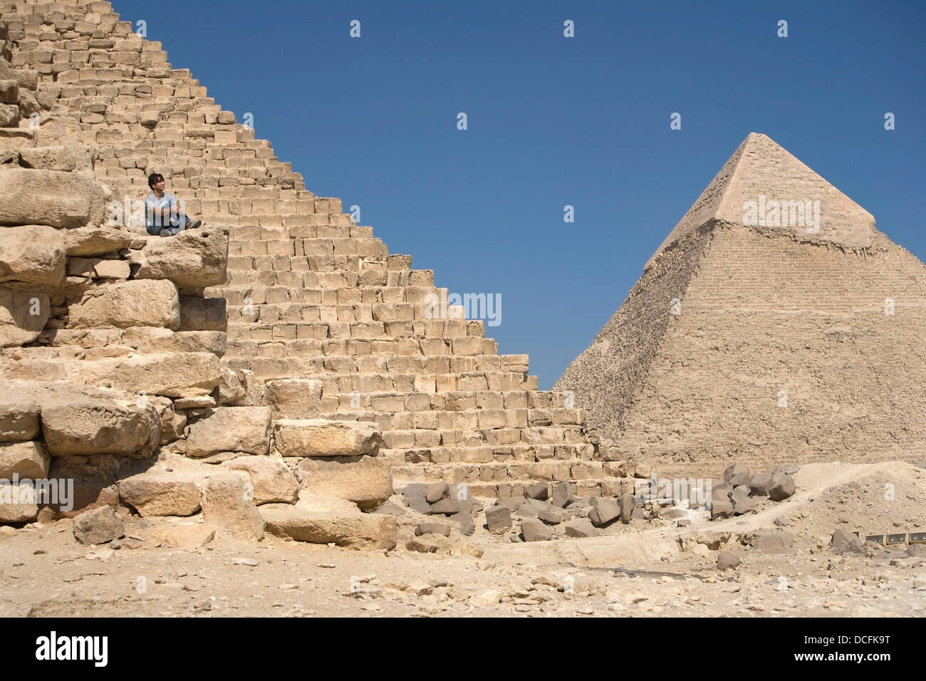Man Sitting On Part Of A Pyramid In The Desert Stock Photo - Alamy