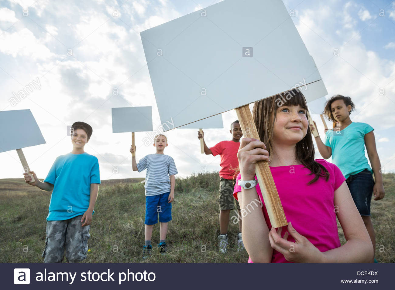 Kids holding sign boards hi-res stock photography and images - Alamy