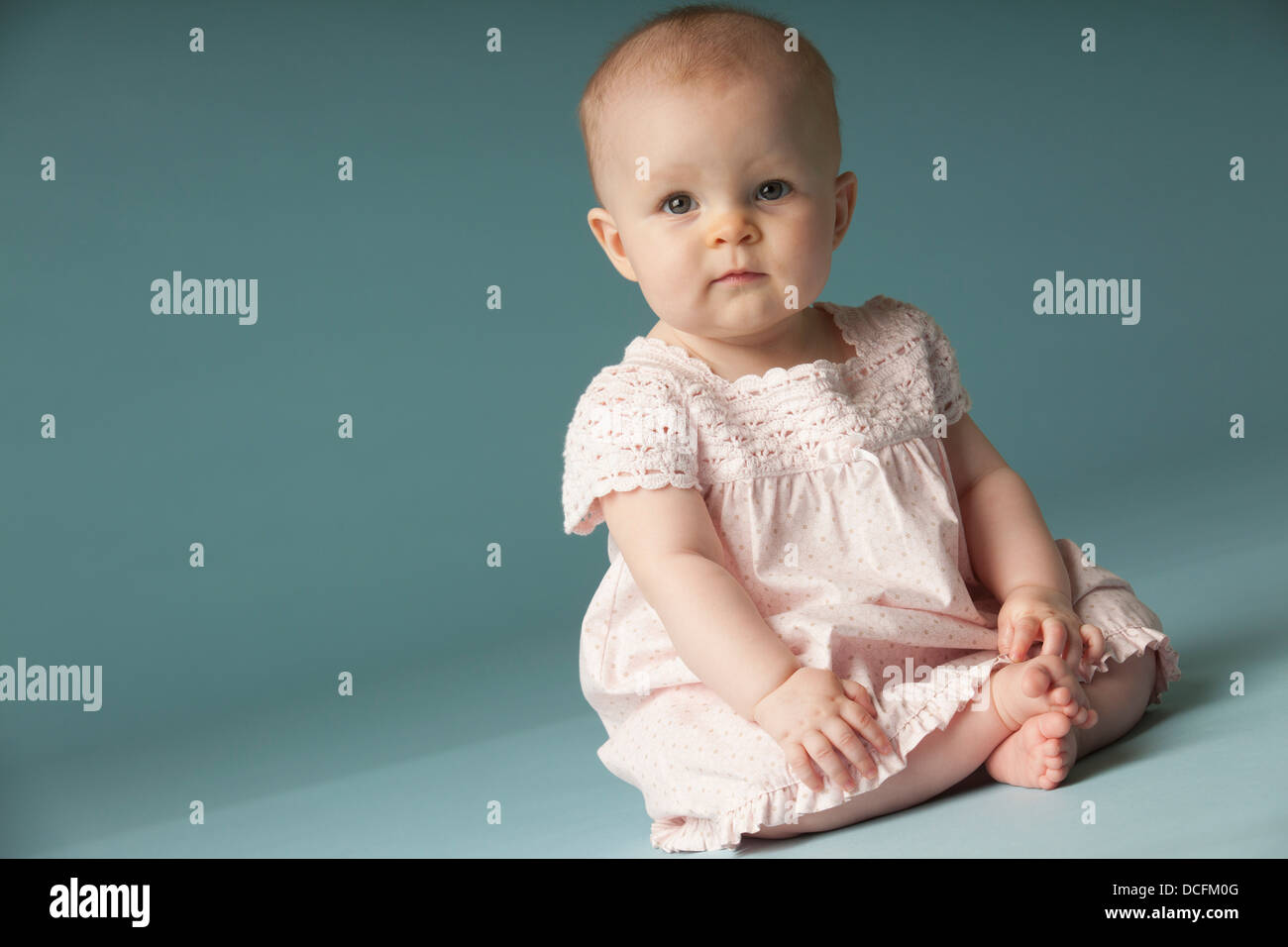 Baby Girl Sitting With Legs Crossed; Nashville, Tennessee, Usa Stock ...