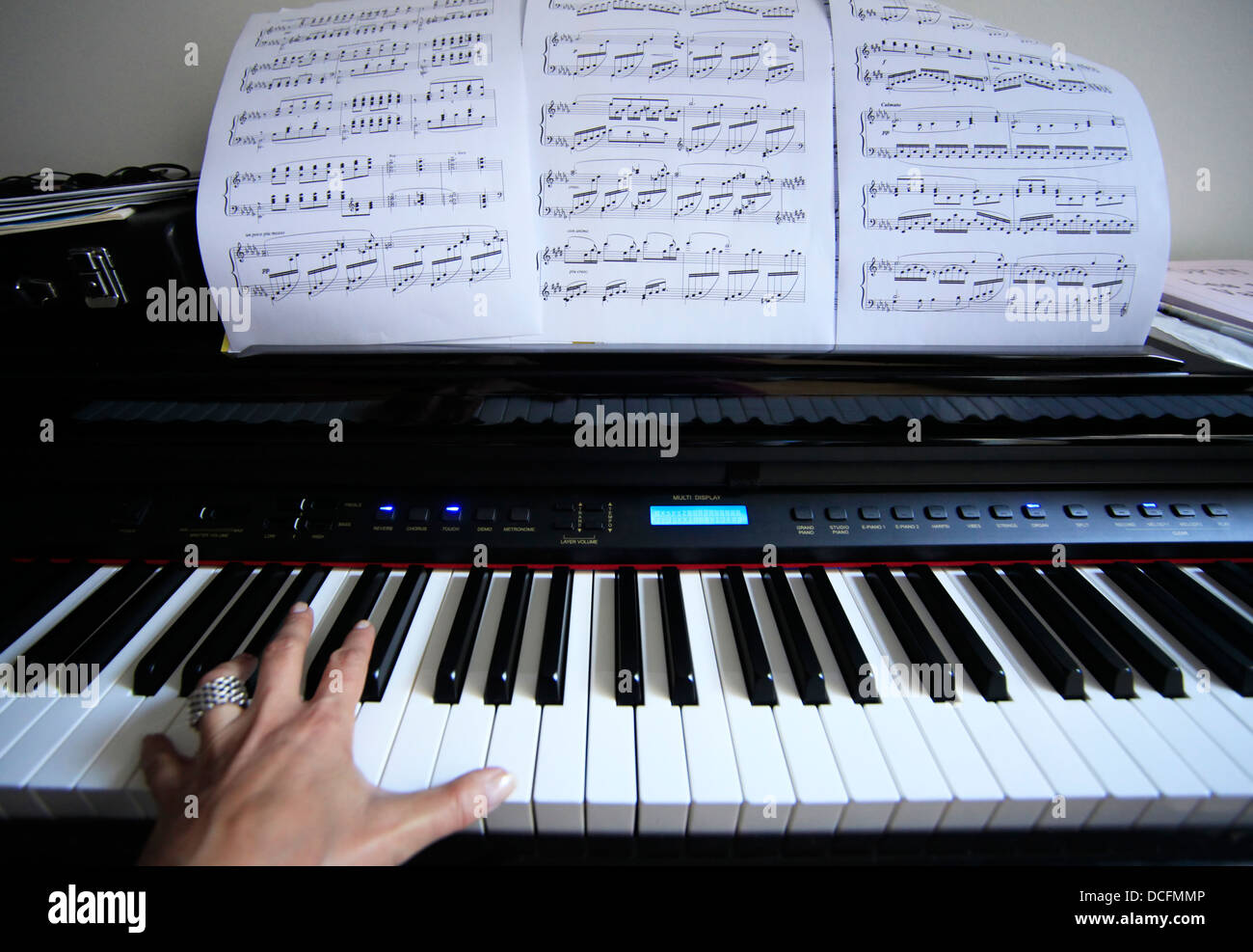 Piano and hand Stock Photo - Alamy