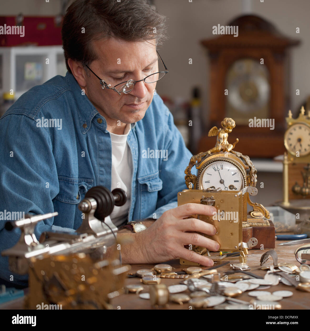 Person repairing clock hi-res stock photography and images - Alamy