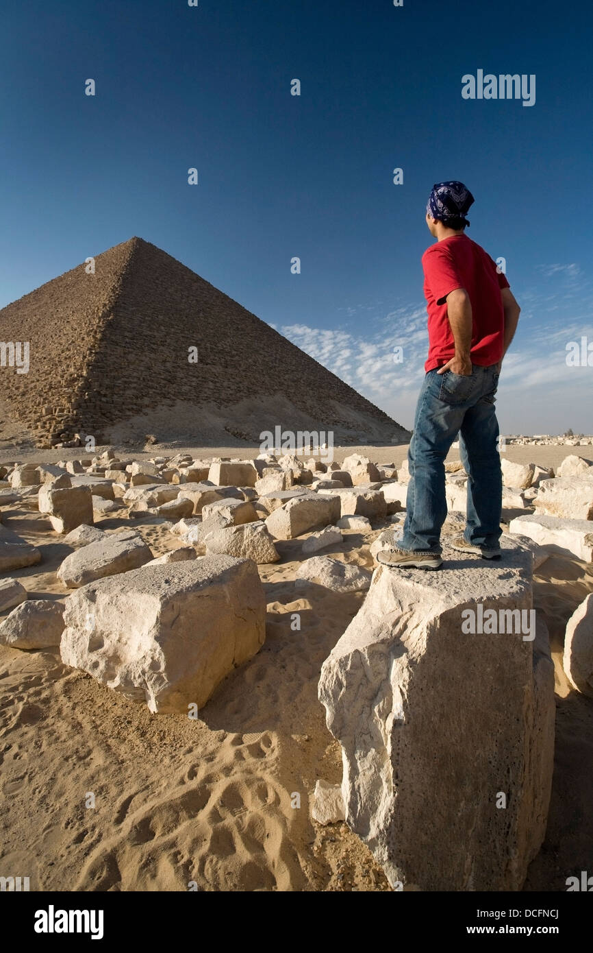 A Man Standing Near A Pyramid In The Desert Stock Photo - Alamy