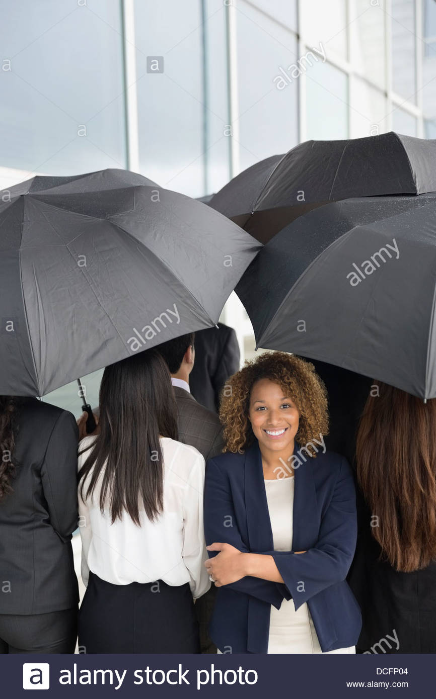Crowd people standing under umbrellas hi-res stock photography and ...