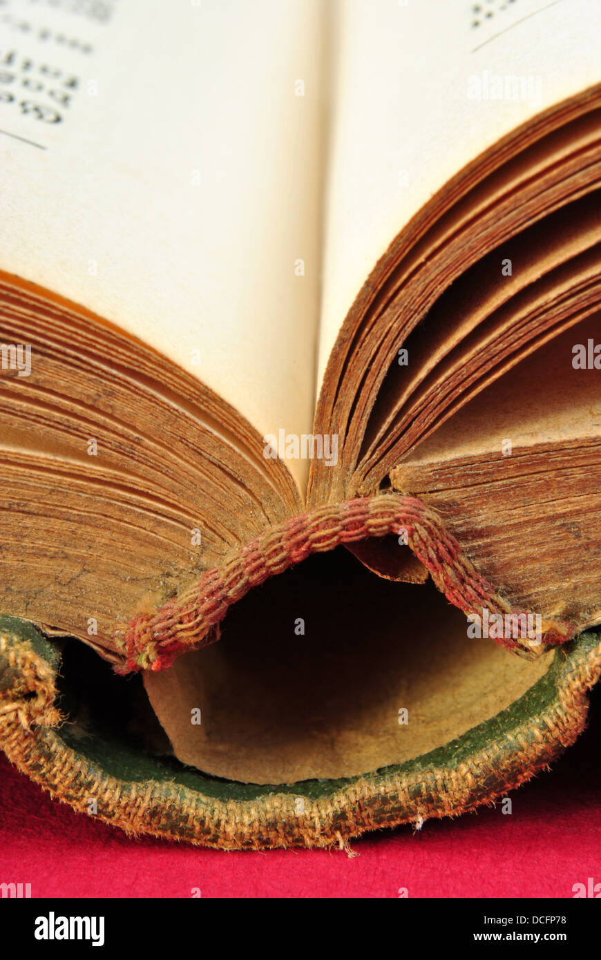 old and antique open book on red background Stock Photo - Alamy