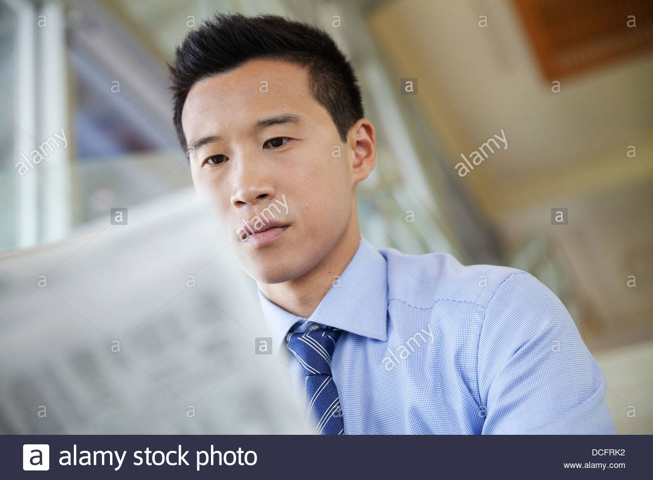 Businessman reading newspaper in office Stock Photo - Alamy Businessman reading newspaper in office Stock Photo - Alamy