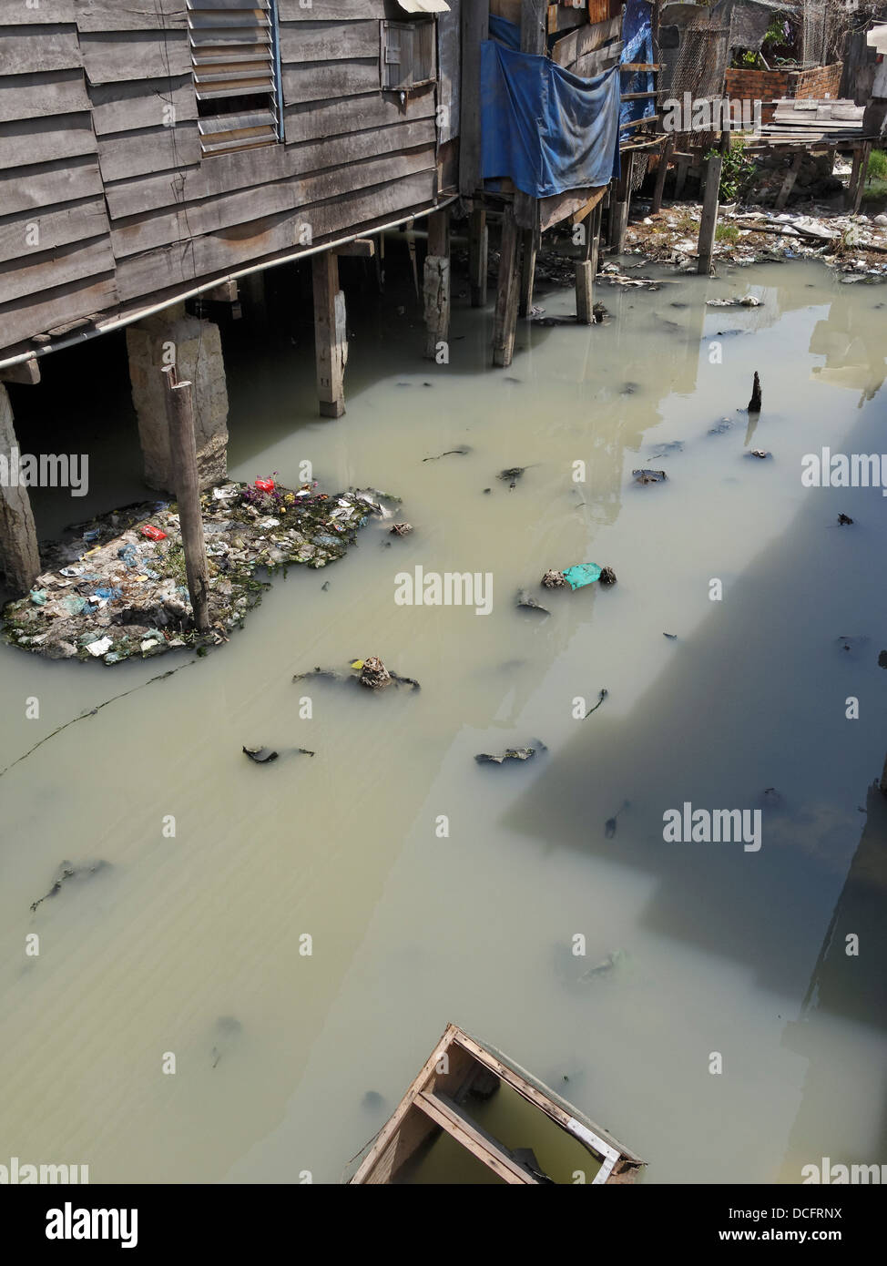 A polluted stream running through a shanty town in Nha Trang, Vietnam ...