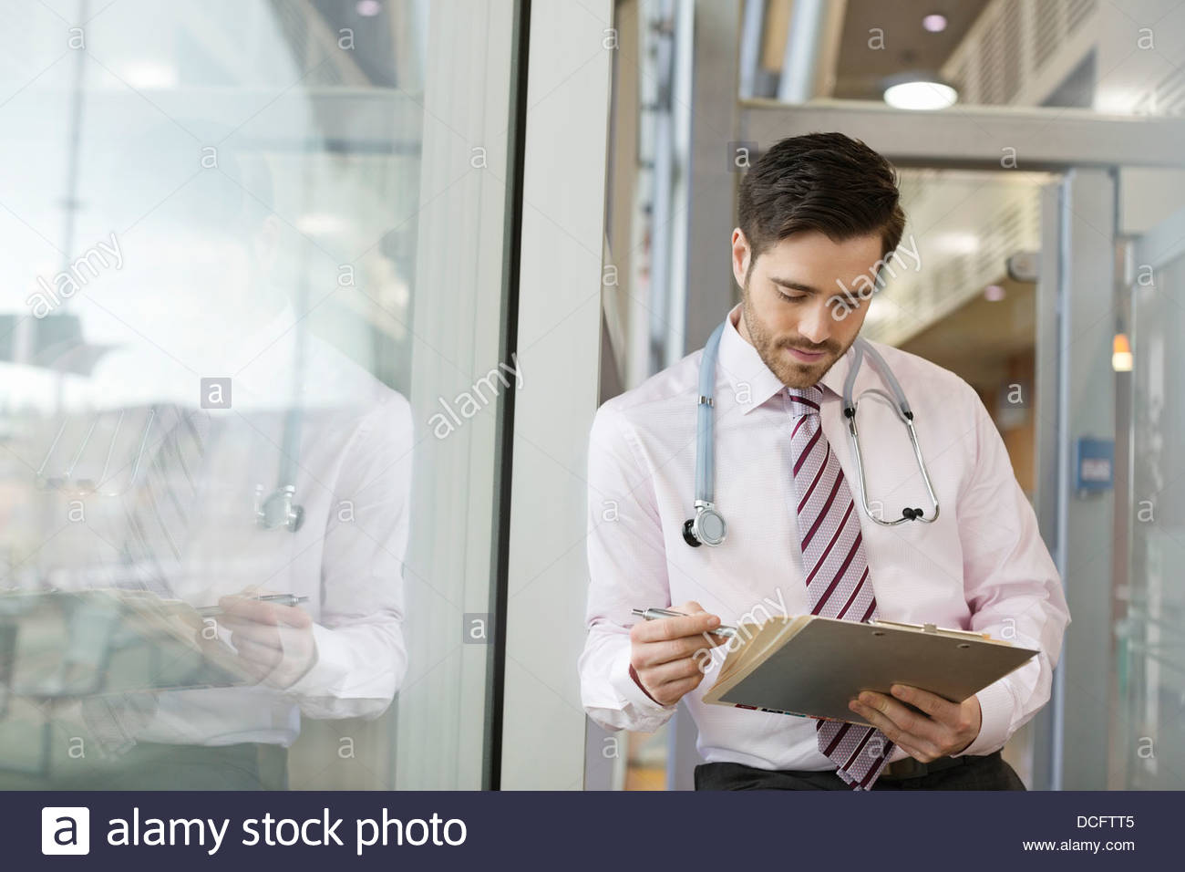 Doctor analyzing hi-res stock photography and images - Alamy