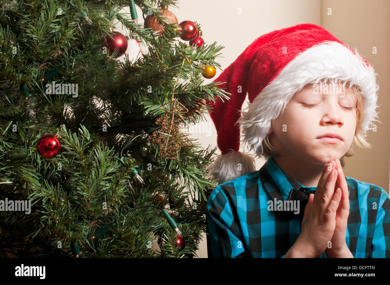Praying for Christmas Stock Photo - Alamy