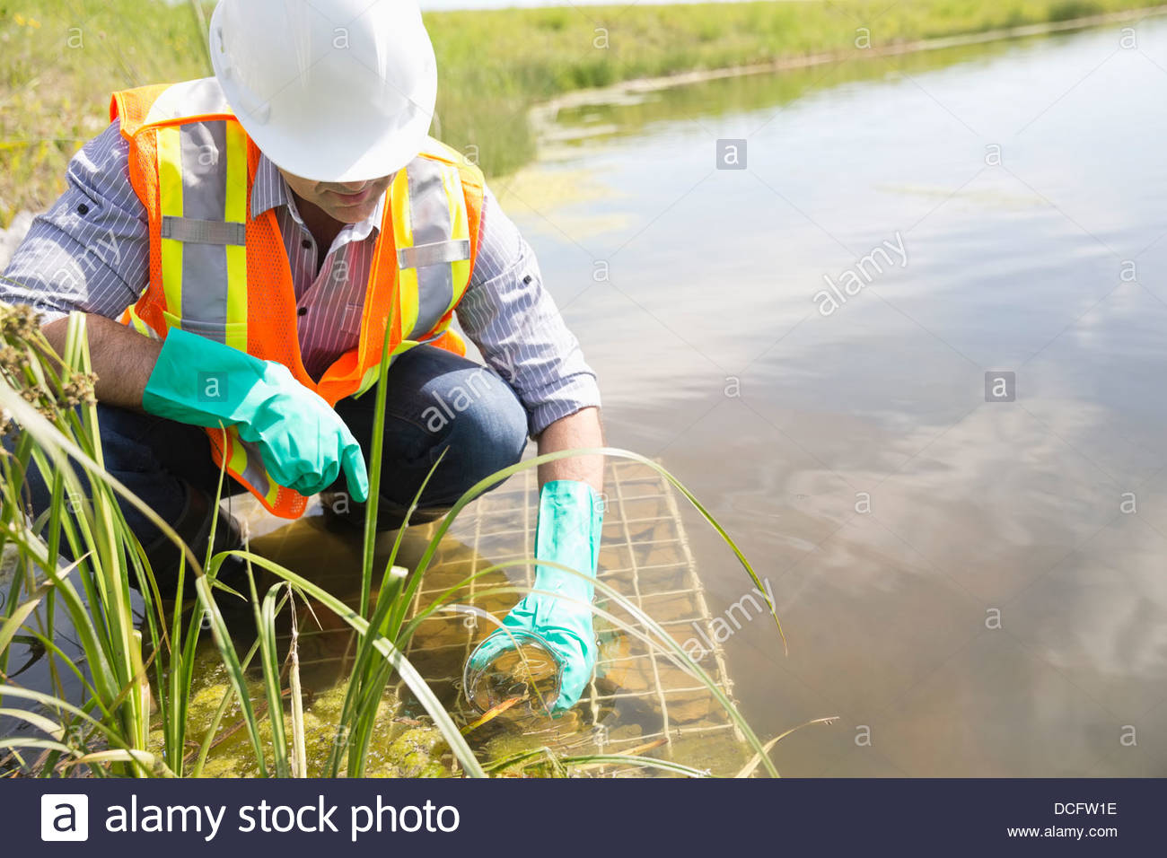 Men collecting water hi-res stock photography and images - Alamy