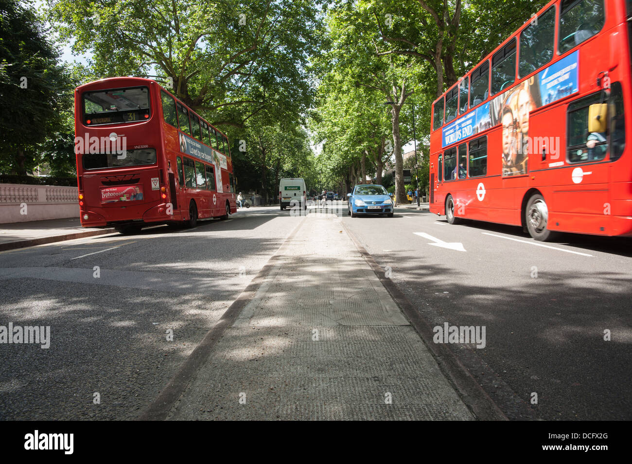 Iconic red double-decker buses in London street Stock Photo - Alamy