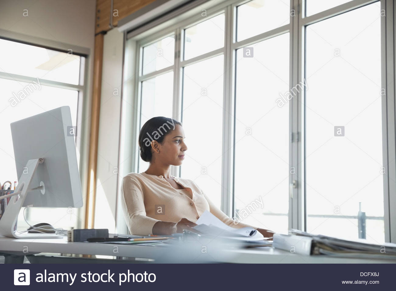 Person looking out of office window hi-res stock photography and images ...