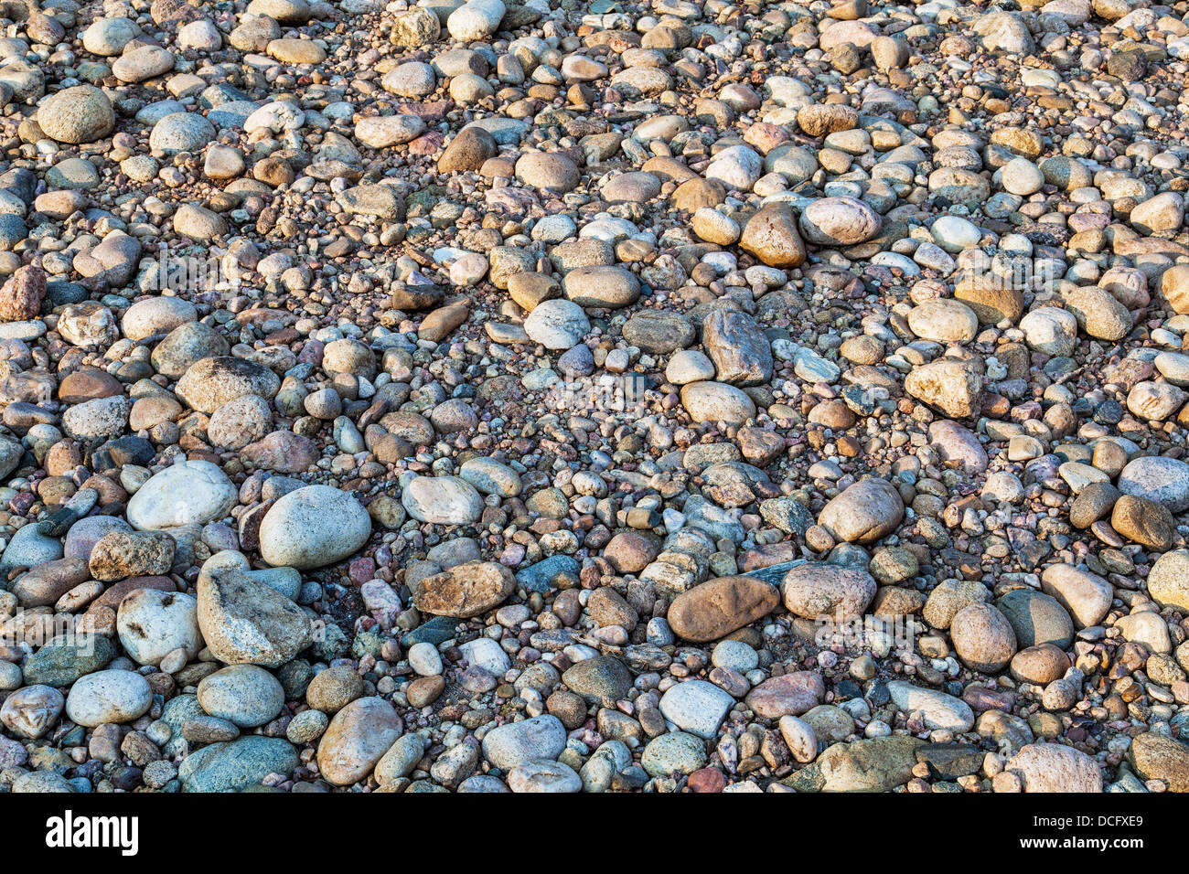 a field of pebbles and rocks - a dry bed of mountain river Stock Photo ...