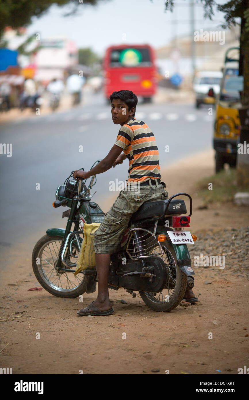 Indian teenager on a motorcycle Stock Photo - Alamy