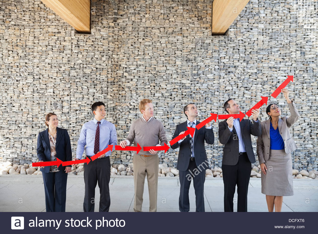 Business people forming upward arrow Stock Photo - Alamy
