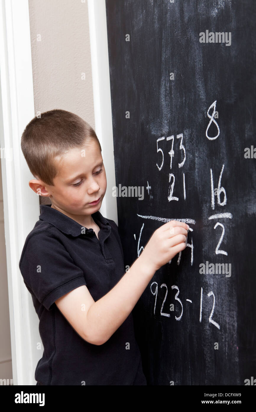 Young Boy in front of the blackboard Stock Photo - Alamy